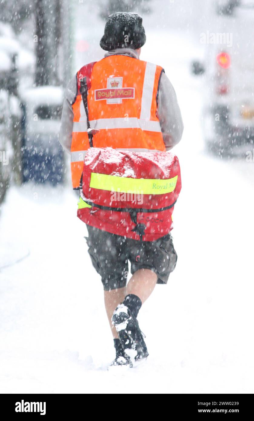 18/12/10 Today Photo ..Laden with Christmas cards, postman, Phil ...