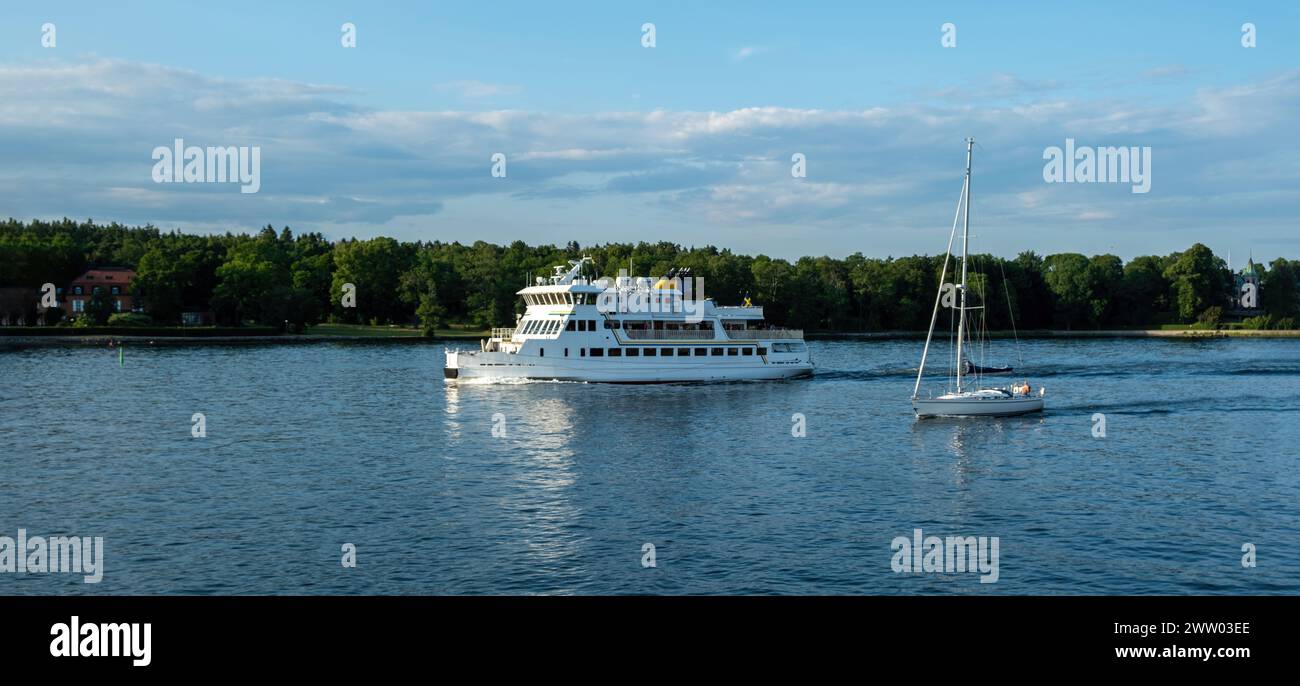Archipelago Stockholm, cruise ship sails next to vessel in ripple sea ...