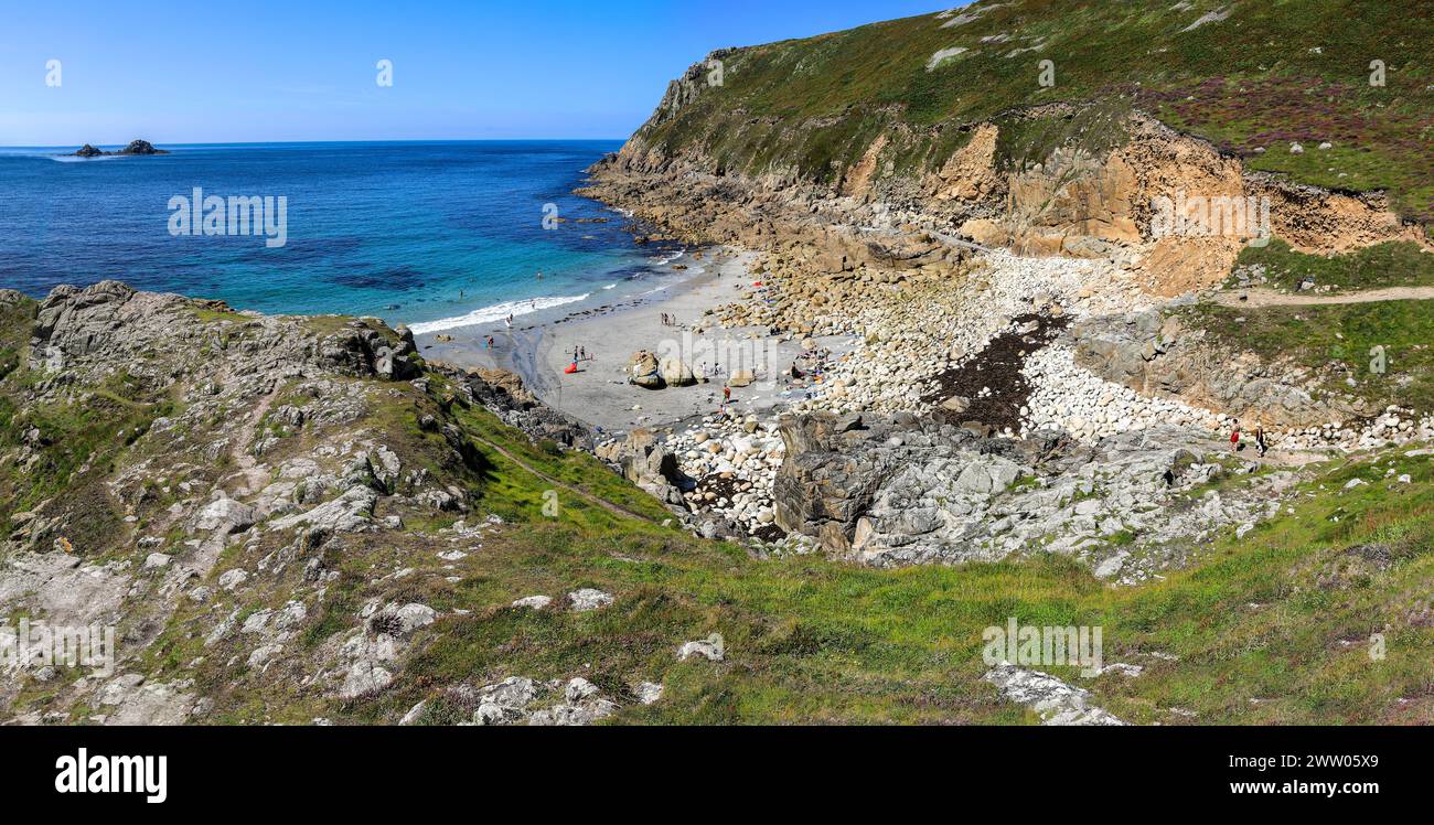 The beach sea and the cliff rocks, with The Brisons in the distance, at ...