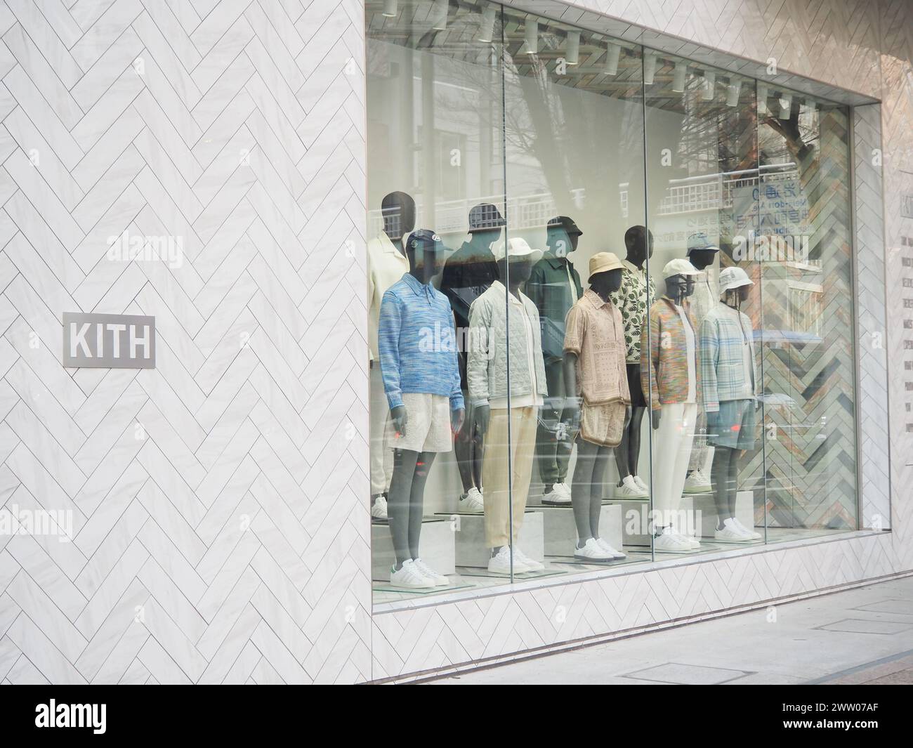 TOKYO, JAPAN - March 19, 2024: Display in the window of a Kith store in ...