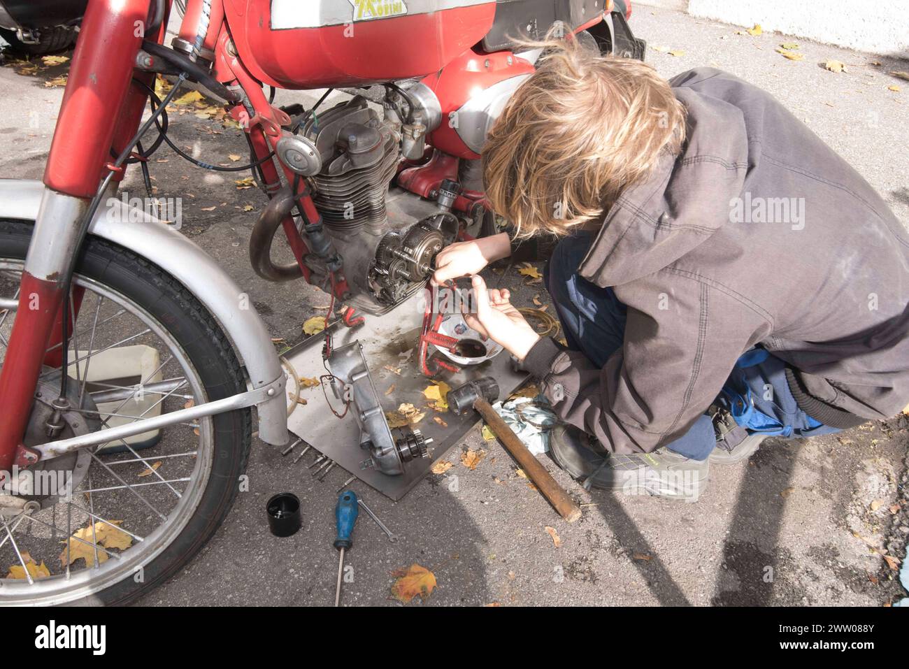 a motorcycle mechanic is repairing a motorcycle, bike repair workshop ...