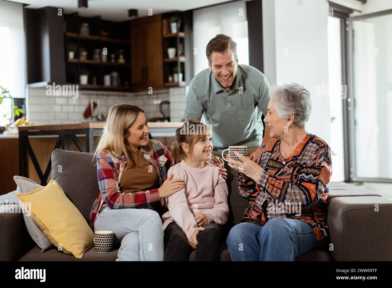 Heartwarming scene unfolds as a multi-generational family gathers on a ...