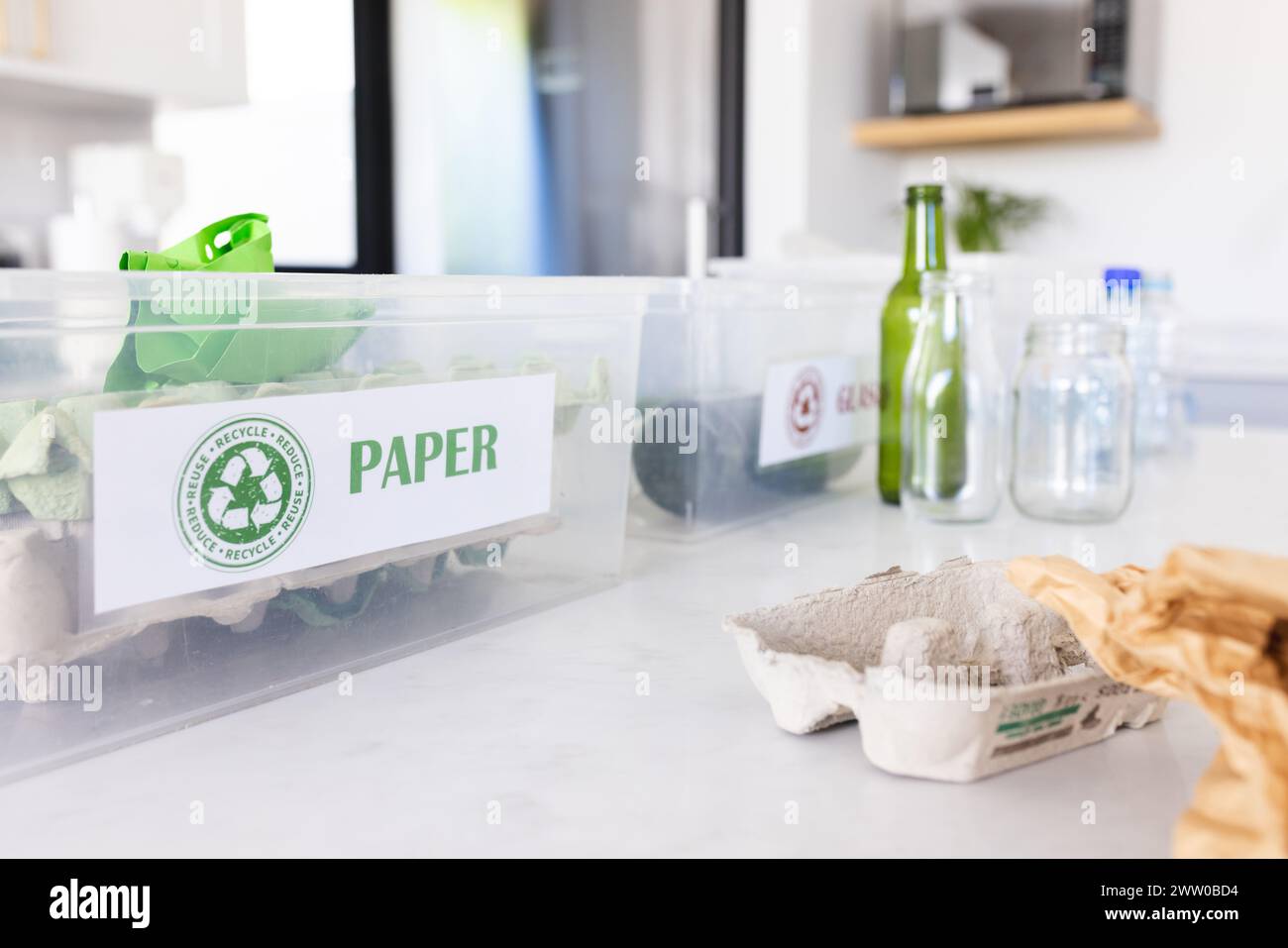 Box of recycling on kitchen counter Stock Photo - Alamy