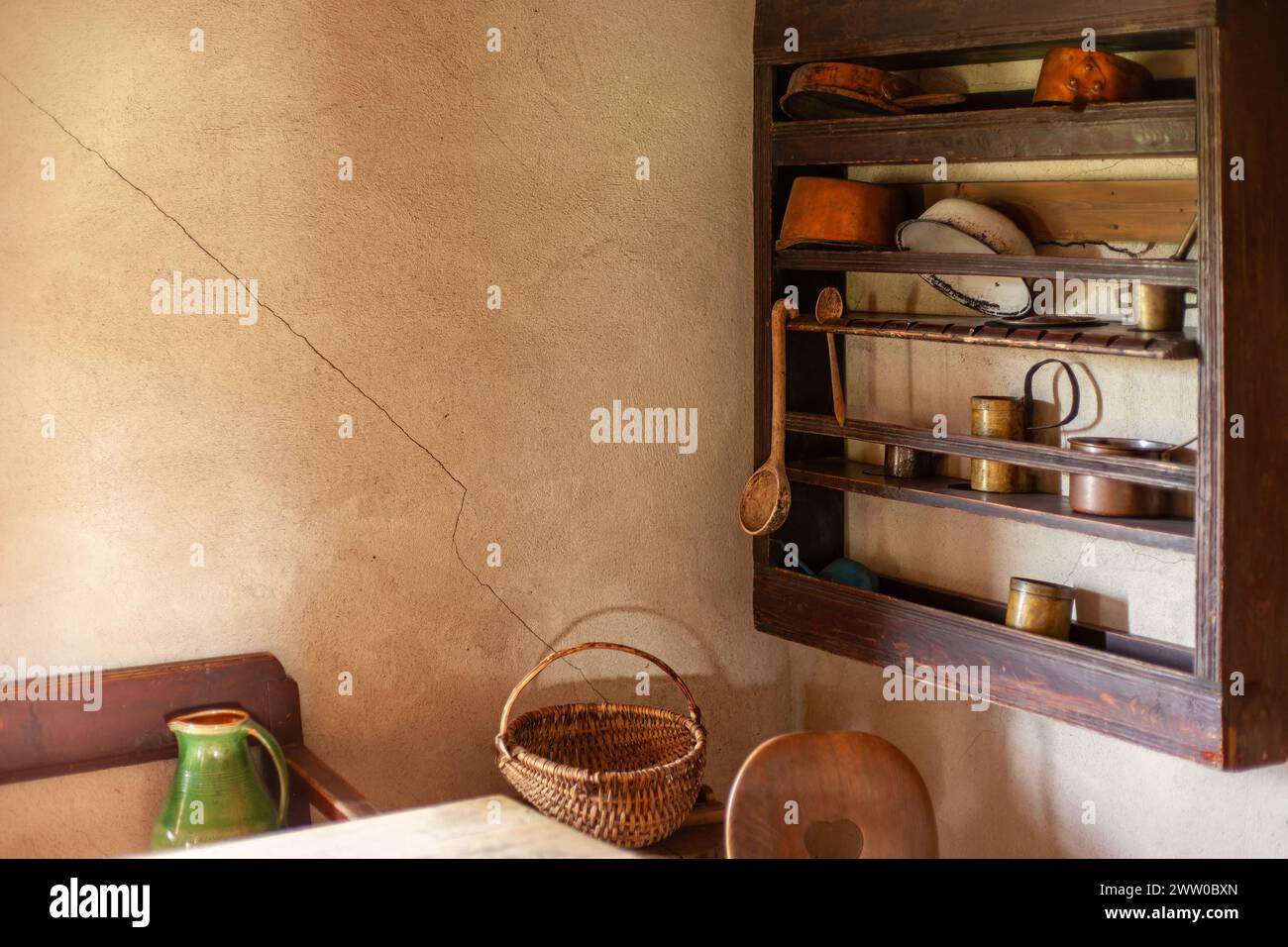 Ancient interior of a room with a shelf full of old dishes Stock Photo ...