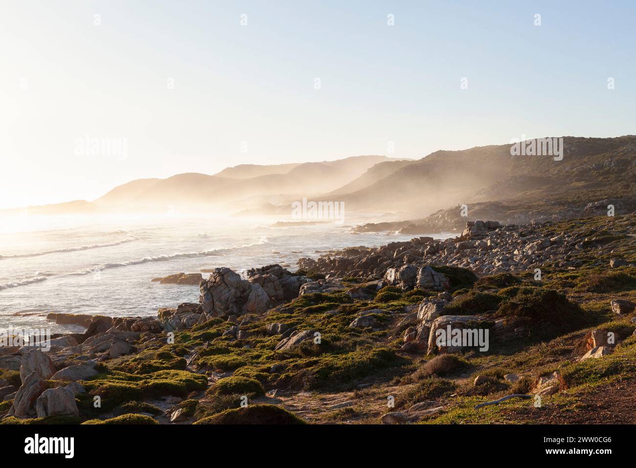 Mist over the sea at dawn, Cape Point, Table Mountain National Park ...
