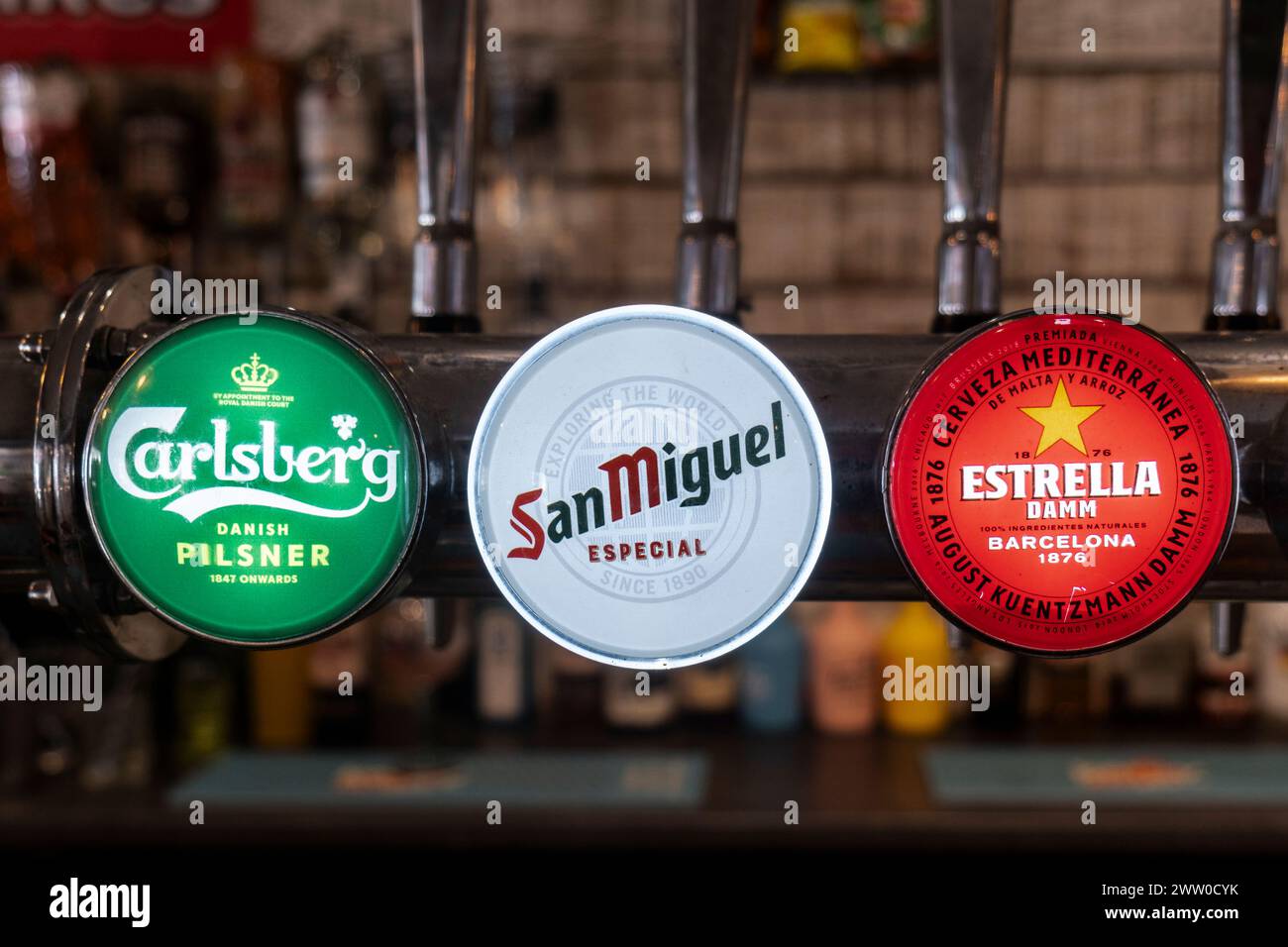 Beer Lager pump clips badges on a beer font engine in a pub in Newquay ...