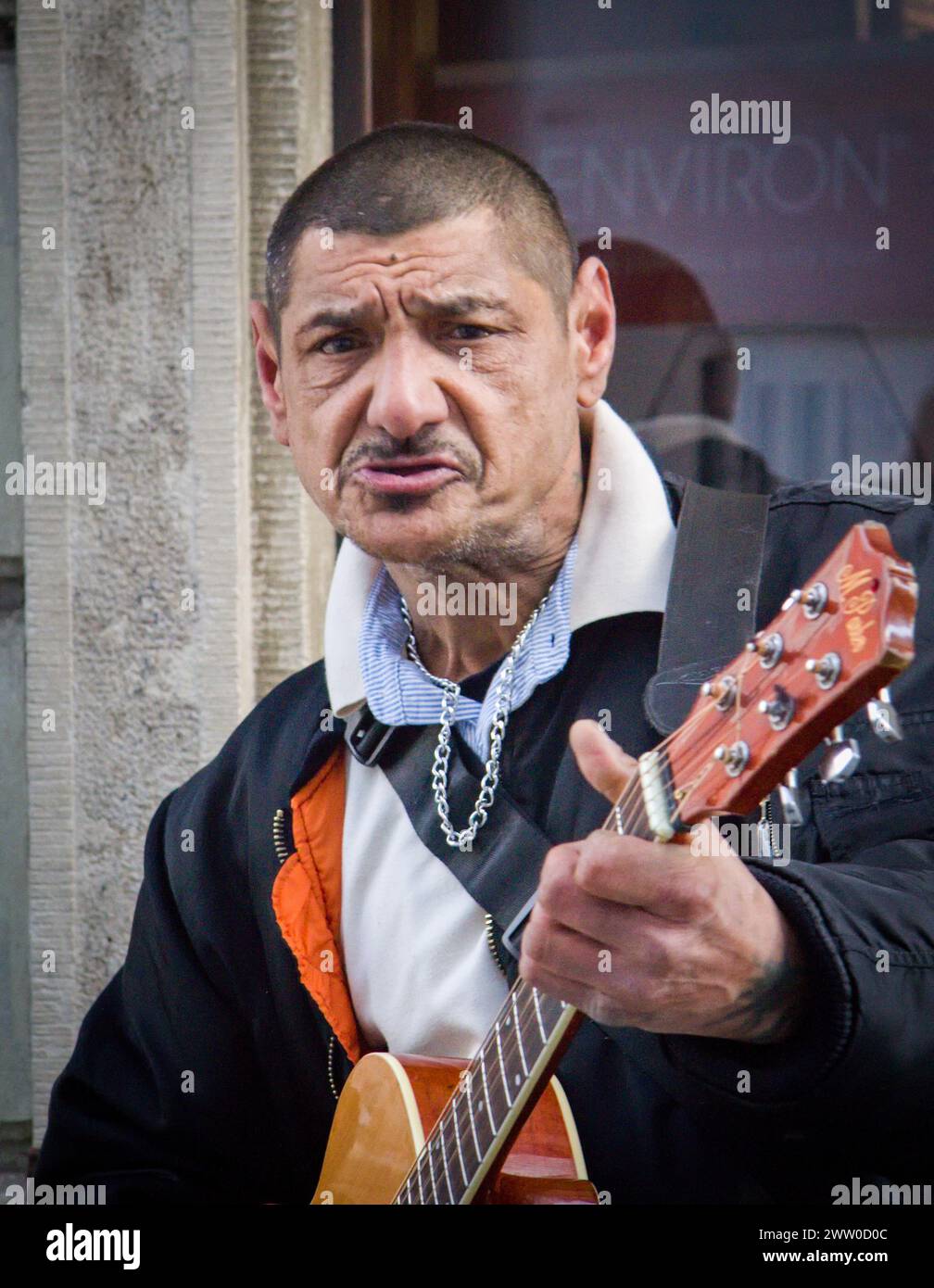 Street musician - a guy playing guitar in the street Stock Photo - Alamy