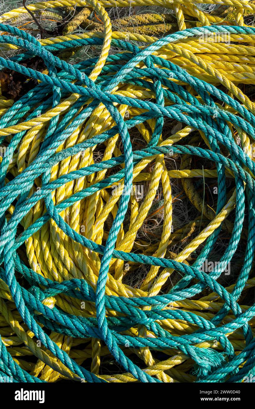Coils of yellow and green nylon Polypropylene rope used for commercial ...