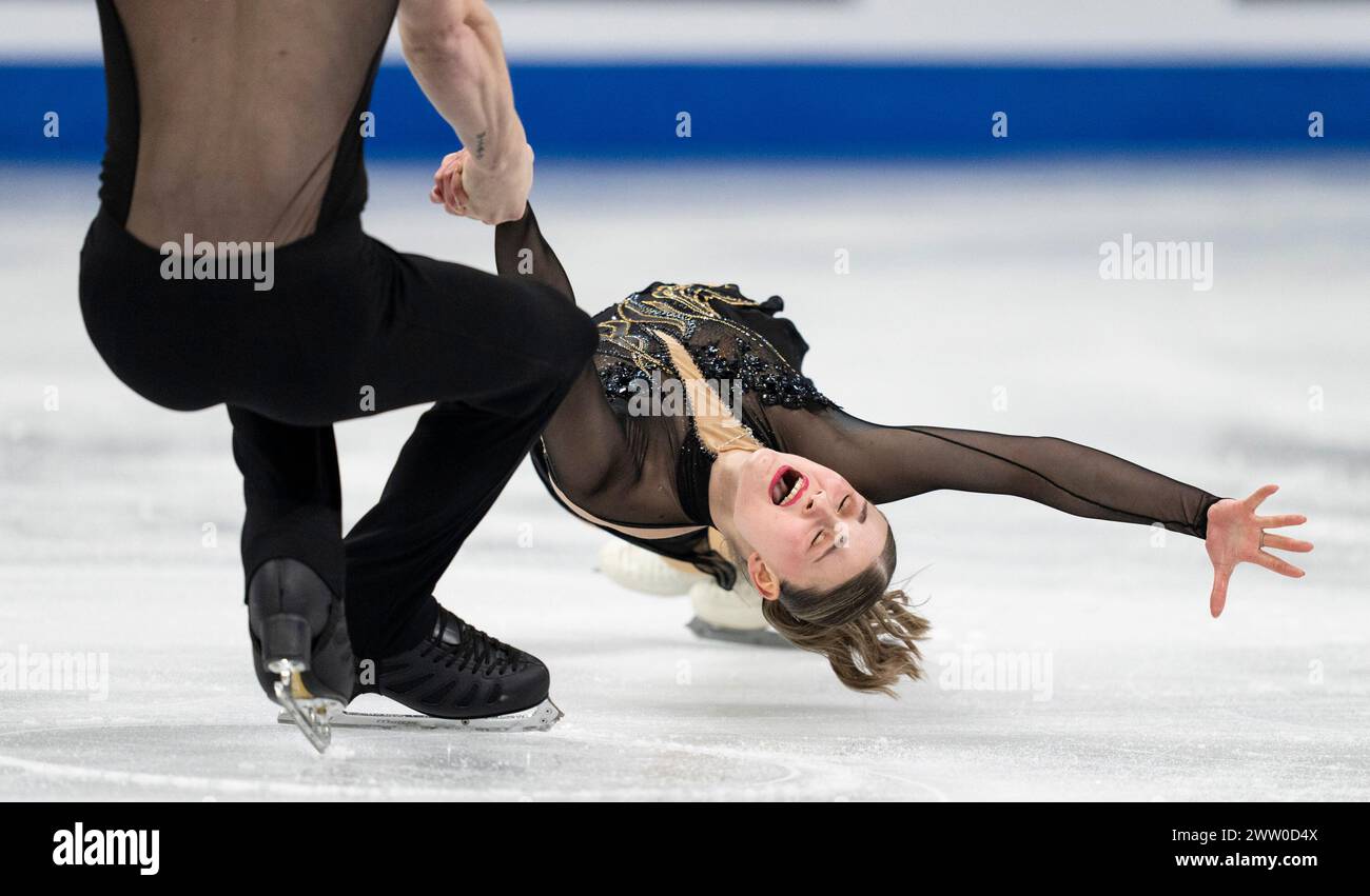 Kelly Ann Laurin and Loucas Ethier, of Canada, perform their pairs ...