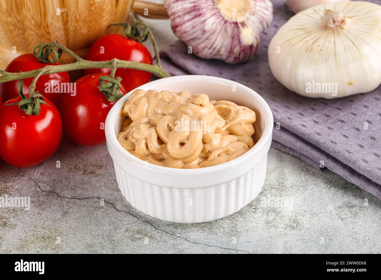 Bowl of Yellow cream grill sauce for burger Stock Photo - Alamy
