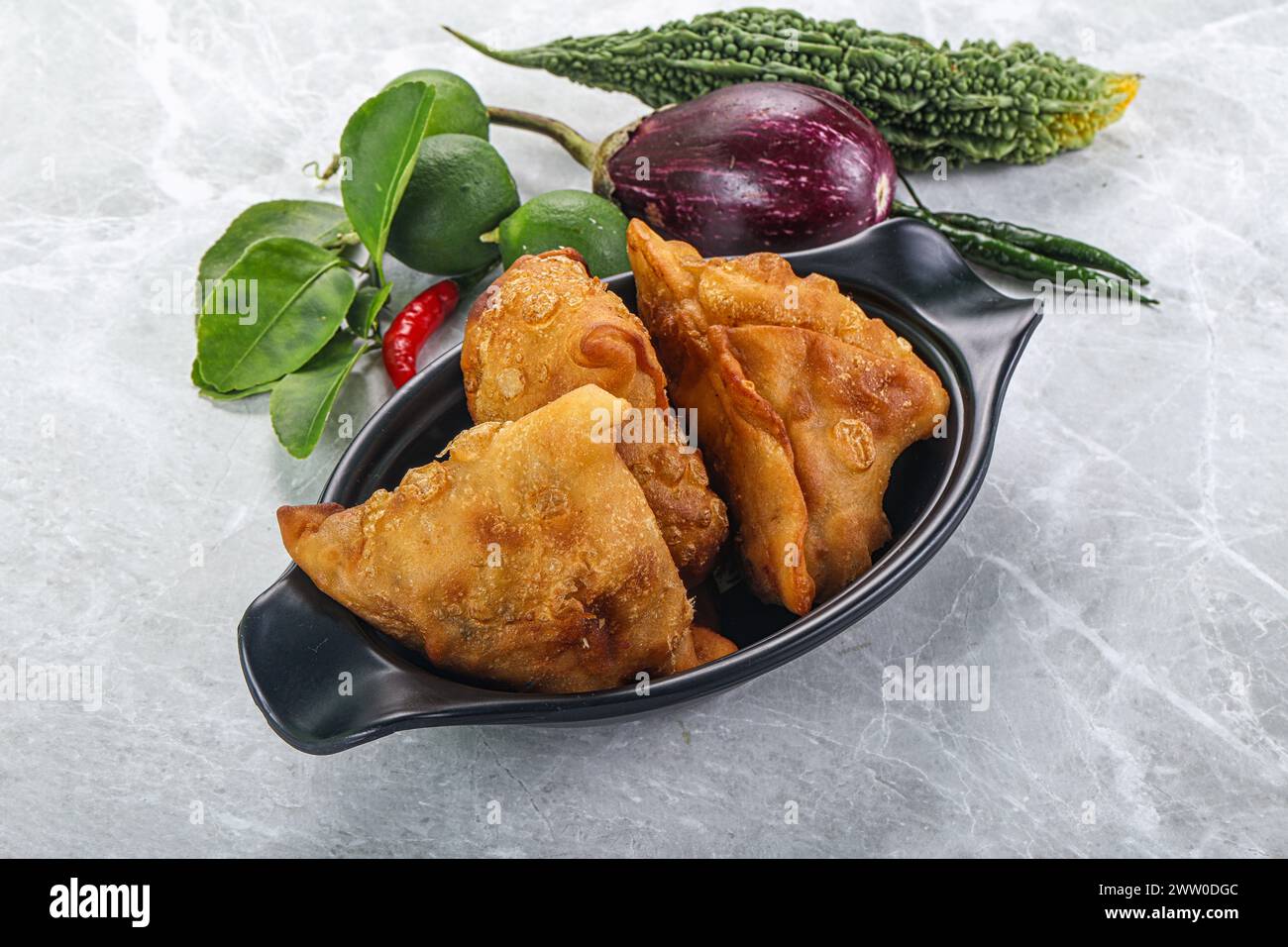 Indian cuisine - fries crispy stuffed samosa Stock Photo - Alamy