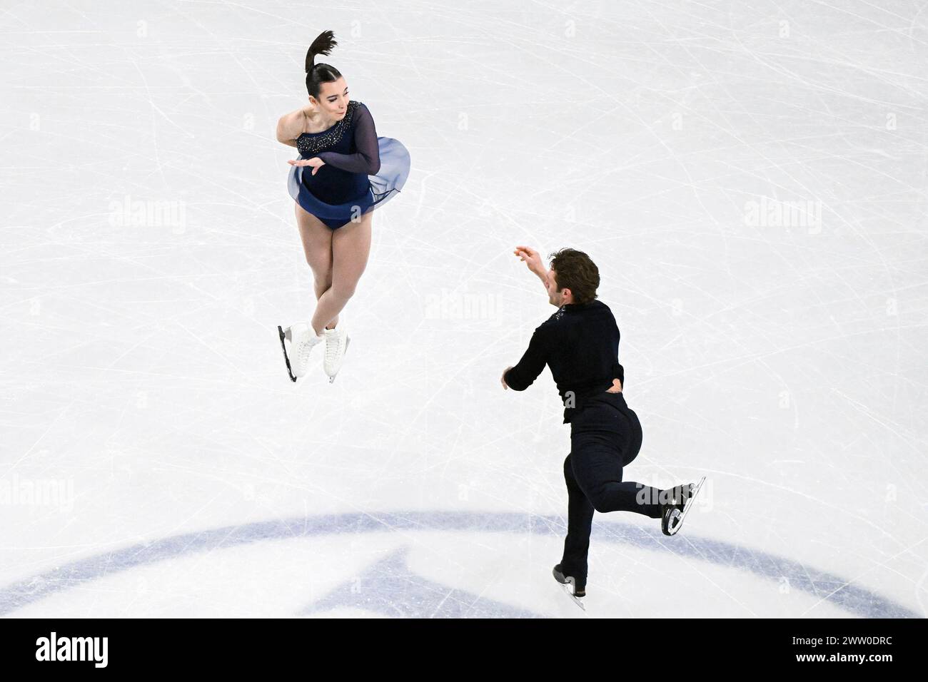 Lia Pereira and Trennt Michaud, of Canada ,perform their pairs short ...