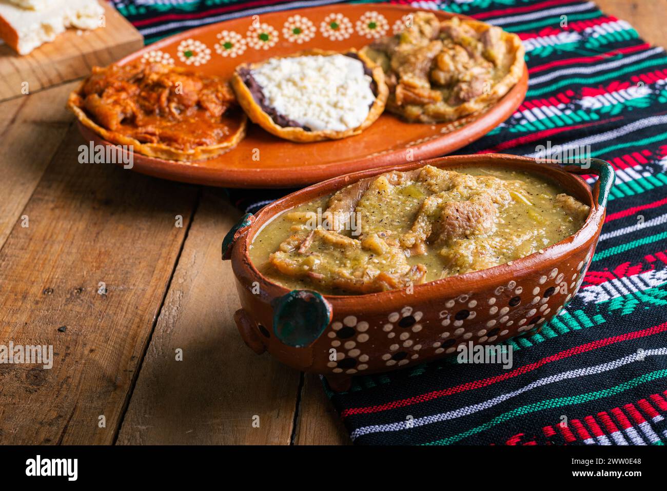 Chicharrones in green sauce, typical mexican food. Mexican food in clay ...