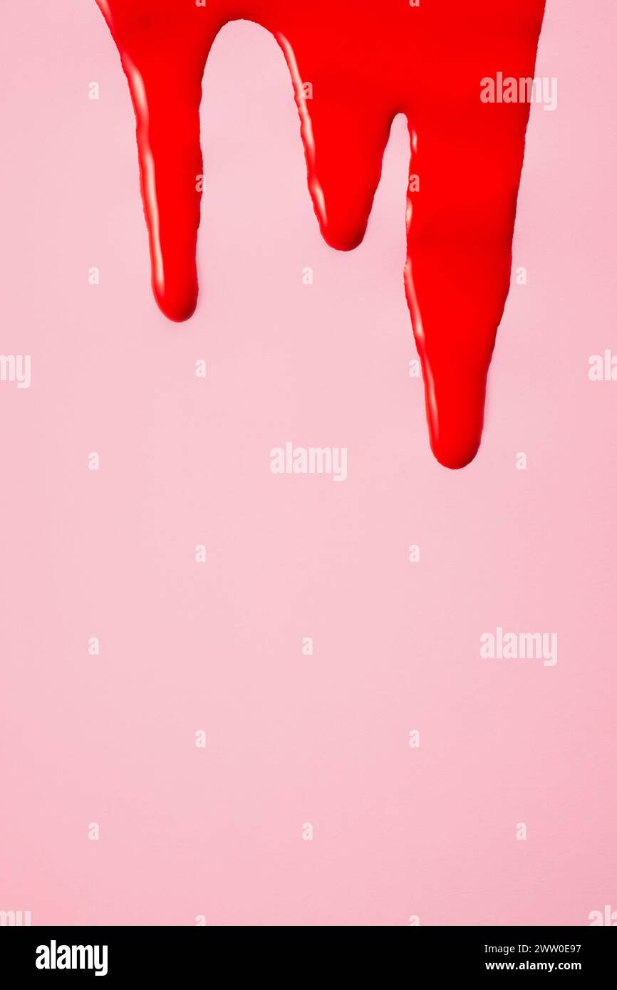 Blood on pink background. First menstrual period concept, menstruation ...