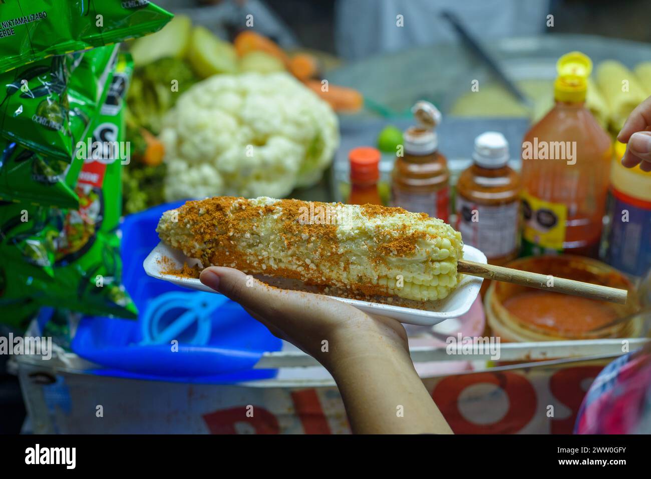 Mexican woman preparing a boiled corn, typical Mexican street food ...