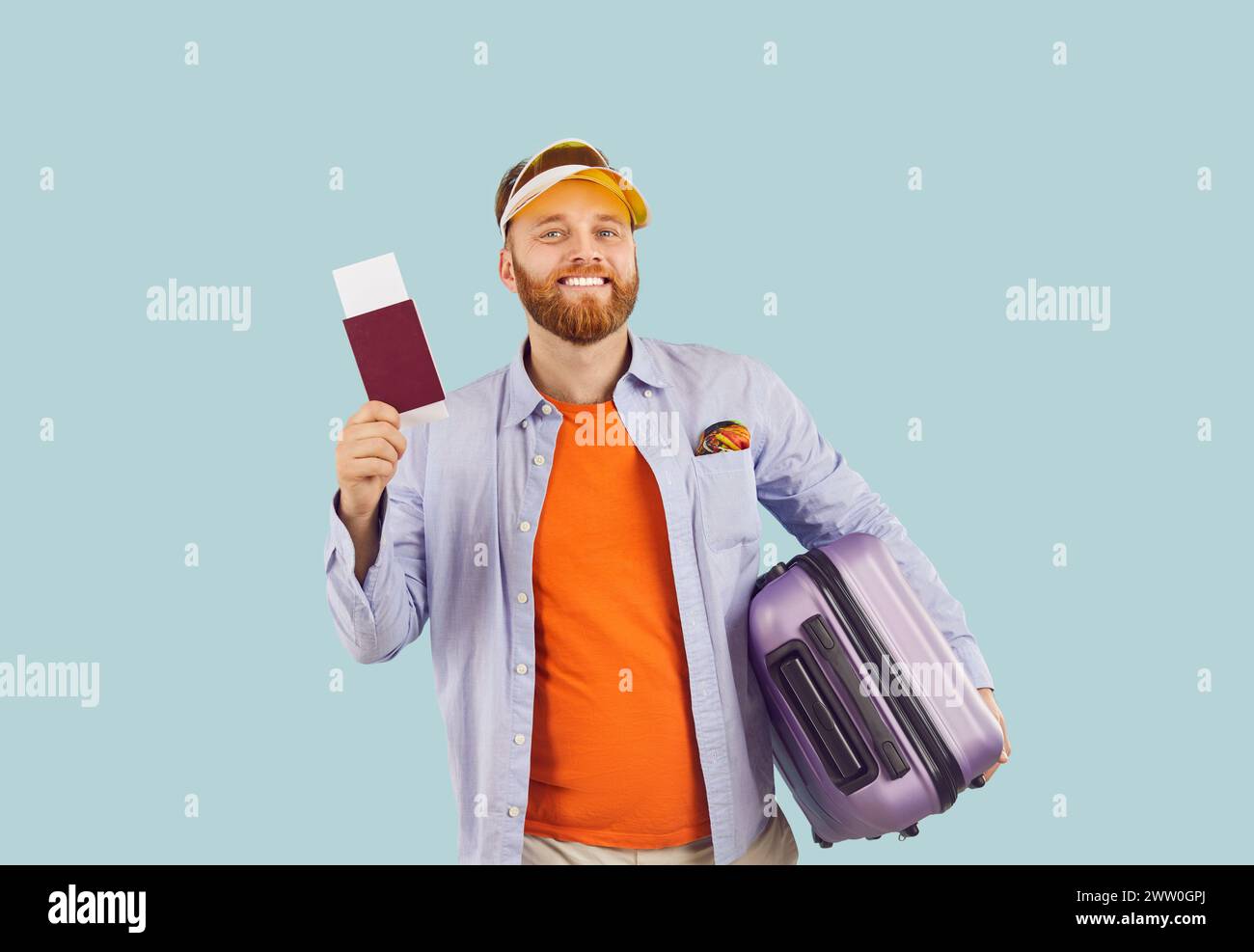 Happy man holding passport with airline ticket, tourist dreaming of ...