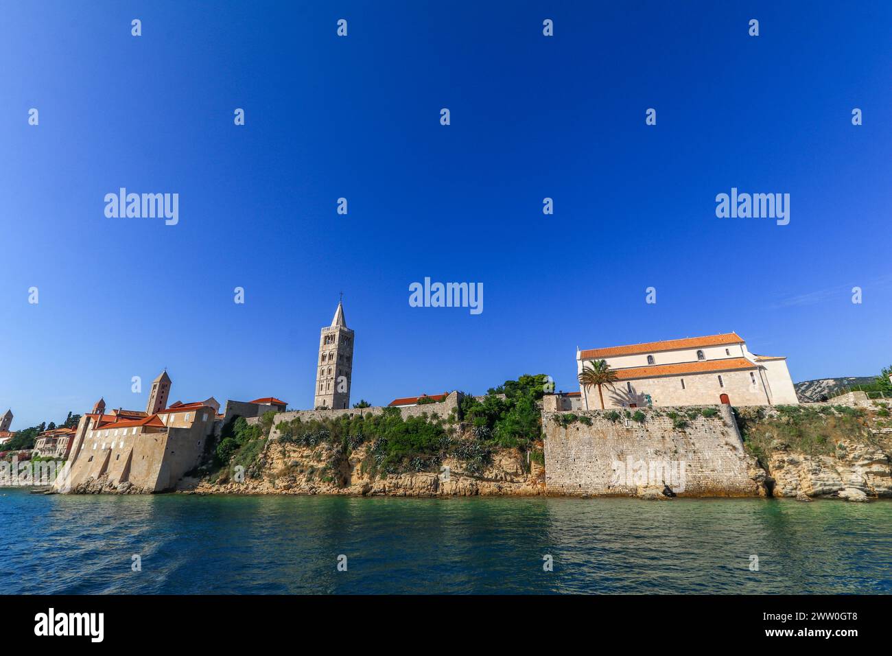 View from the boat over the old town of Rab, historic four church ...