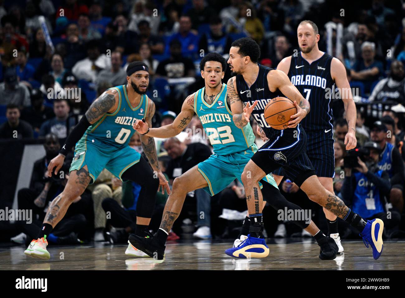 Orlando Magic guard Cole Anthony (50) is defended by Charlotte Hornets ...