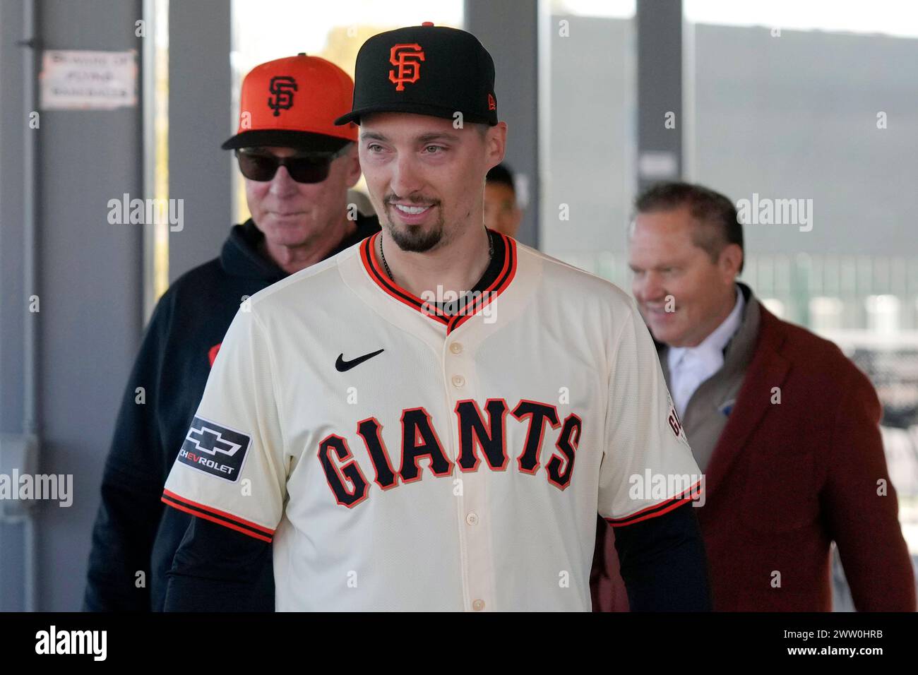 New San Francisco Giants pitcher Blake Snell, center, walks with Giants ...