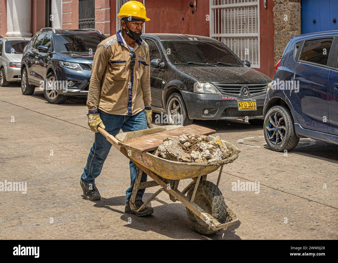 Cartagena, Colombia - July 25, 2023: Construction worker pushing ...