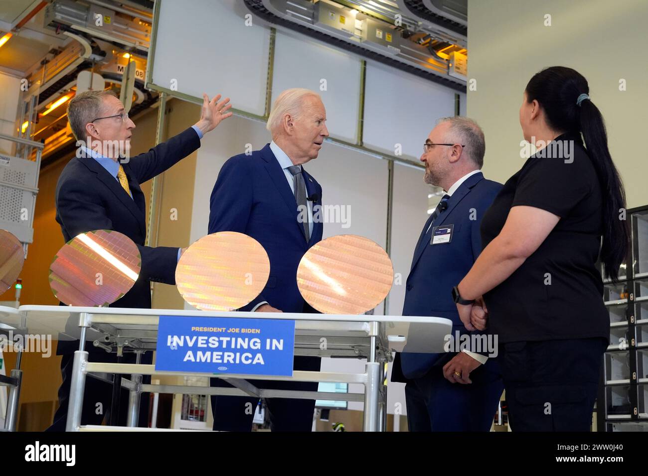 President Joe Biden listens to Intel CEO Pat Gelsinger, left, as Intel ...