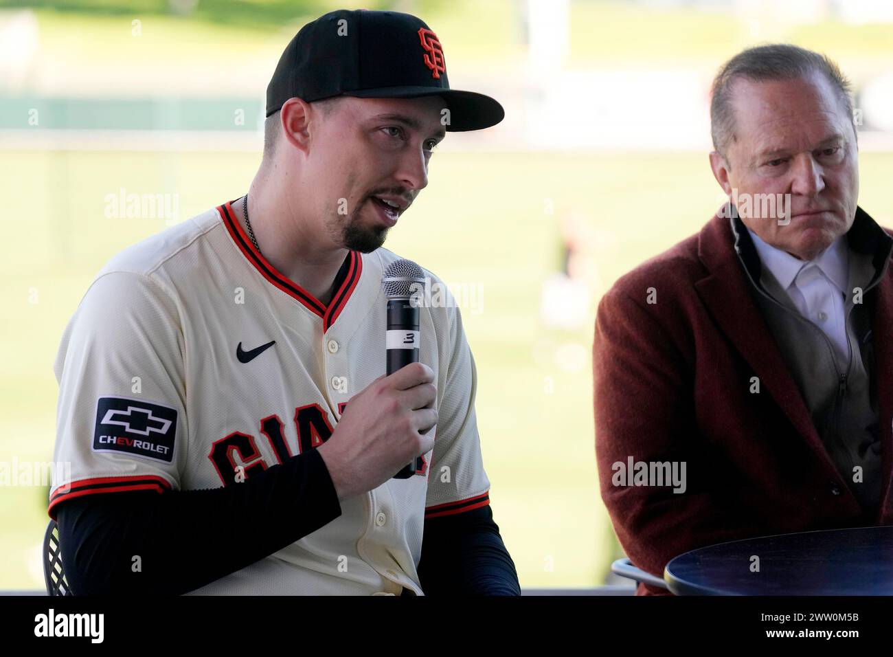 New San Francisco Giants pitcher Blake Snell, left, speaks as he is ...