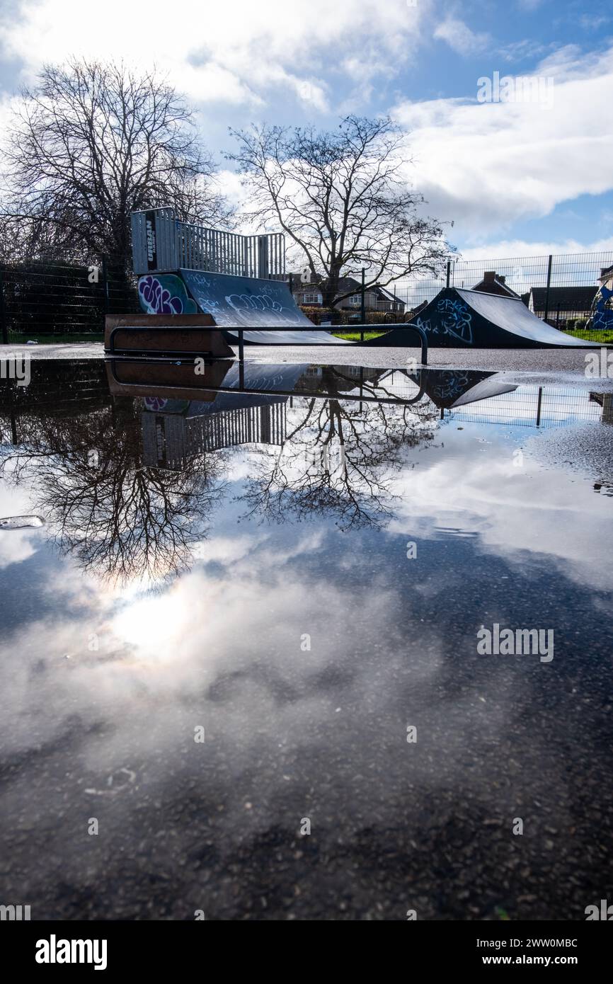 Empty skateboarding ramp reflecting in a puddle of rain water Stock ...
