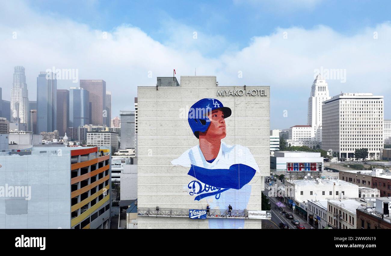 Muralist Robert Vargas, center, works on a new Los Angeles Dodgers ...