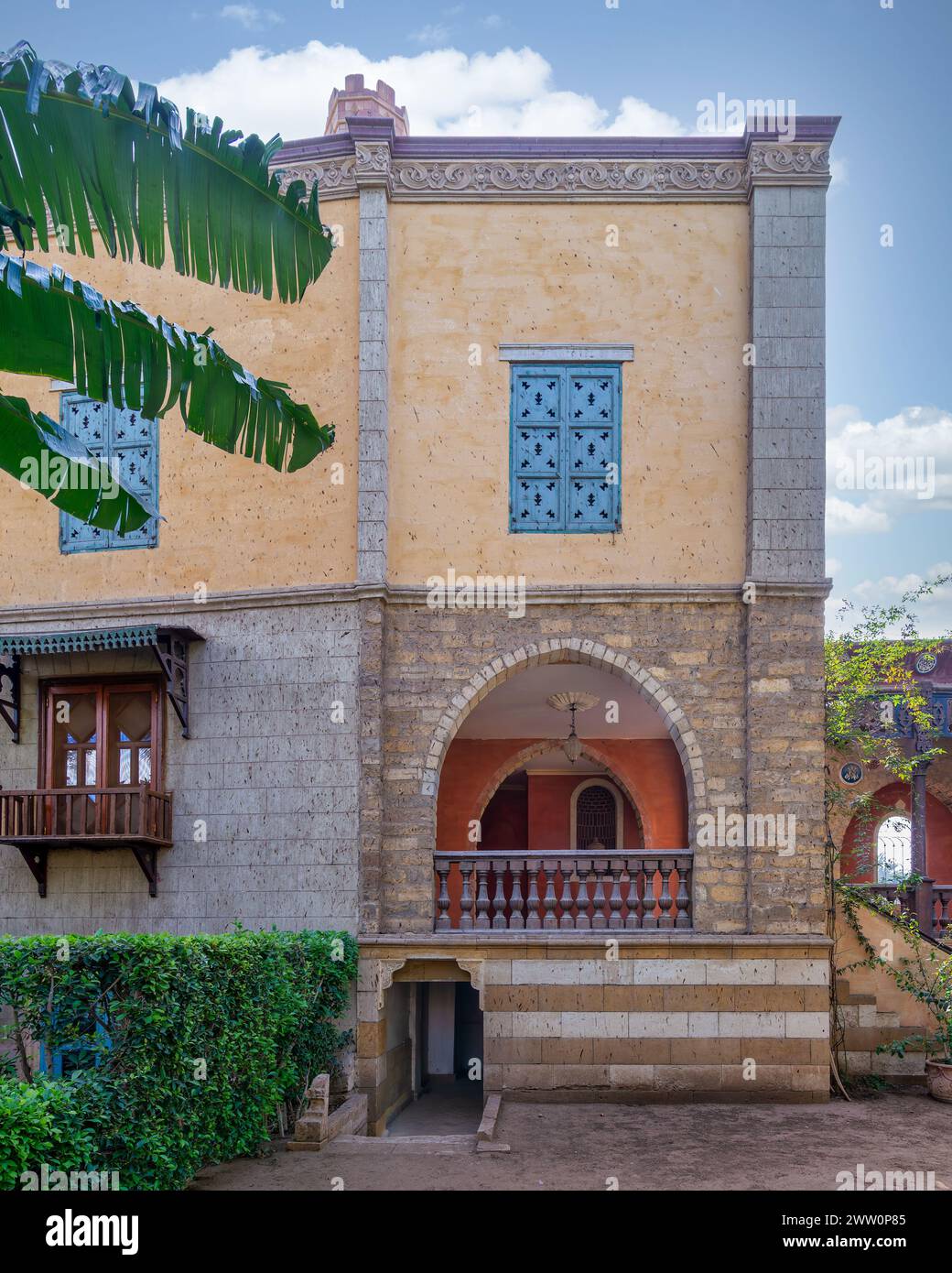 A serene view of a rustic style building featuring an arched wooden ...