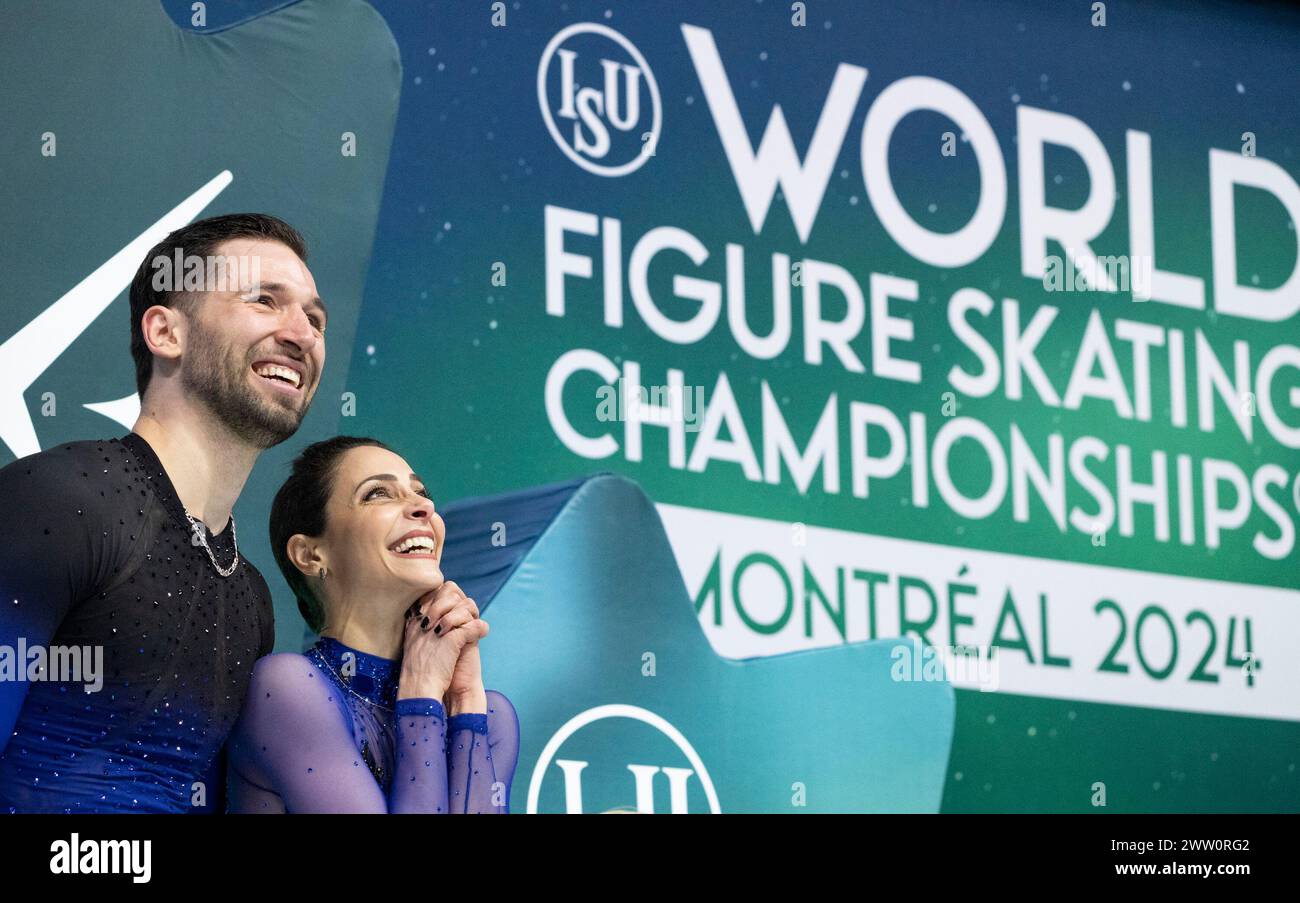 Deanna Stellato-Dudek and Maxime Deschamps, of Canada, react to their ...