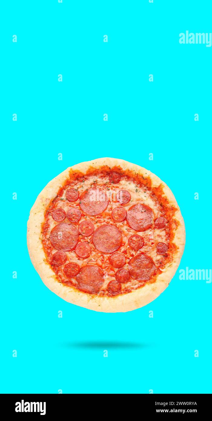 Tasty Pepperoni pizza on bright light blue background Stock Photo - Alamy