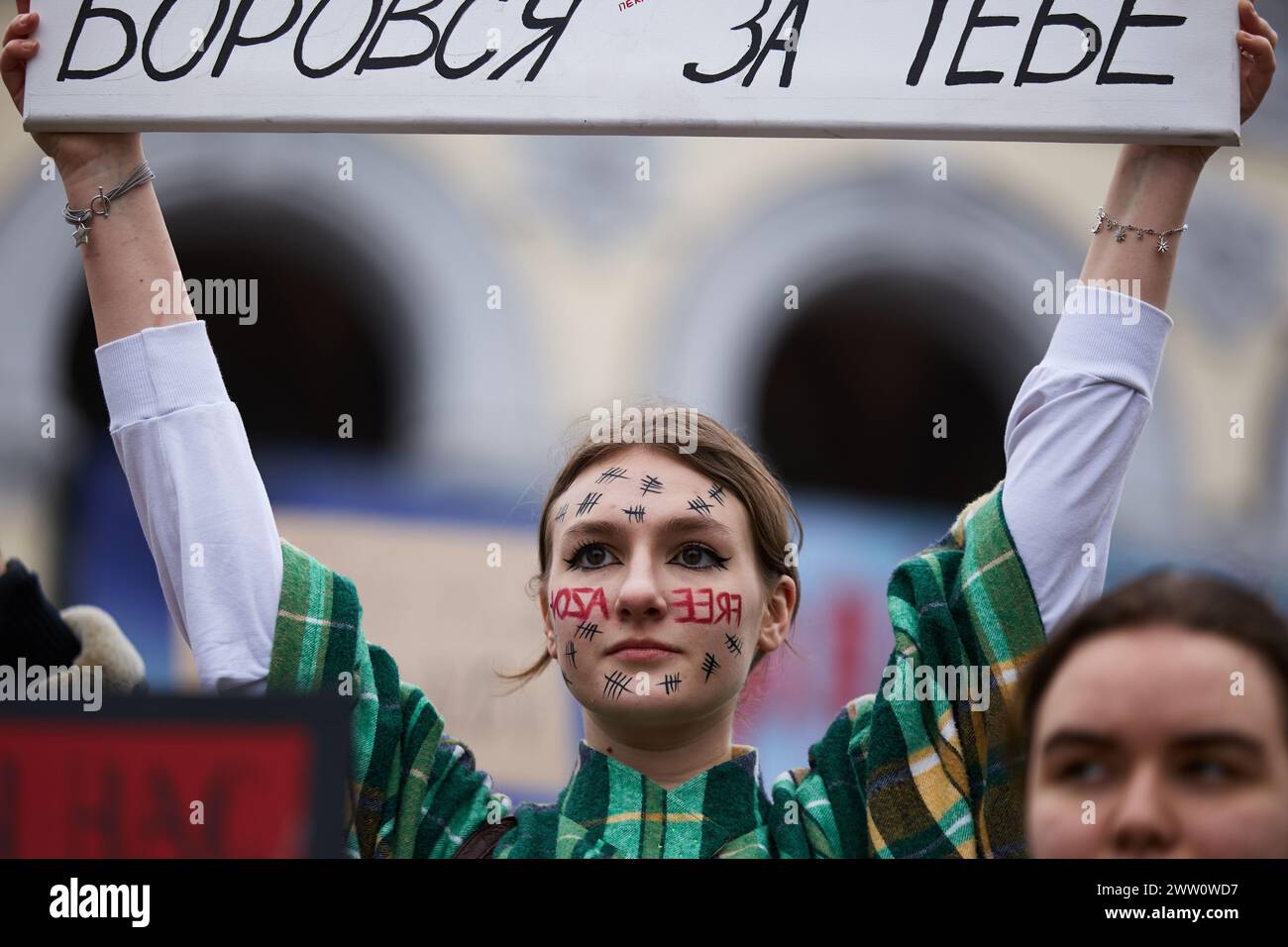 Young Ukrainian girl wearing a makeup with writing "Free Azov" on her ...