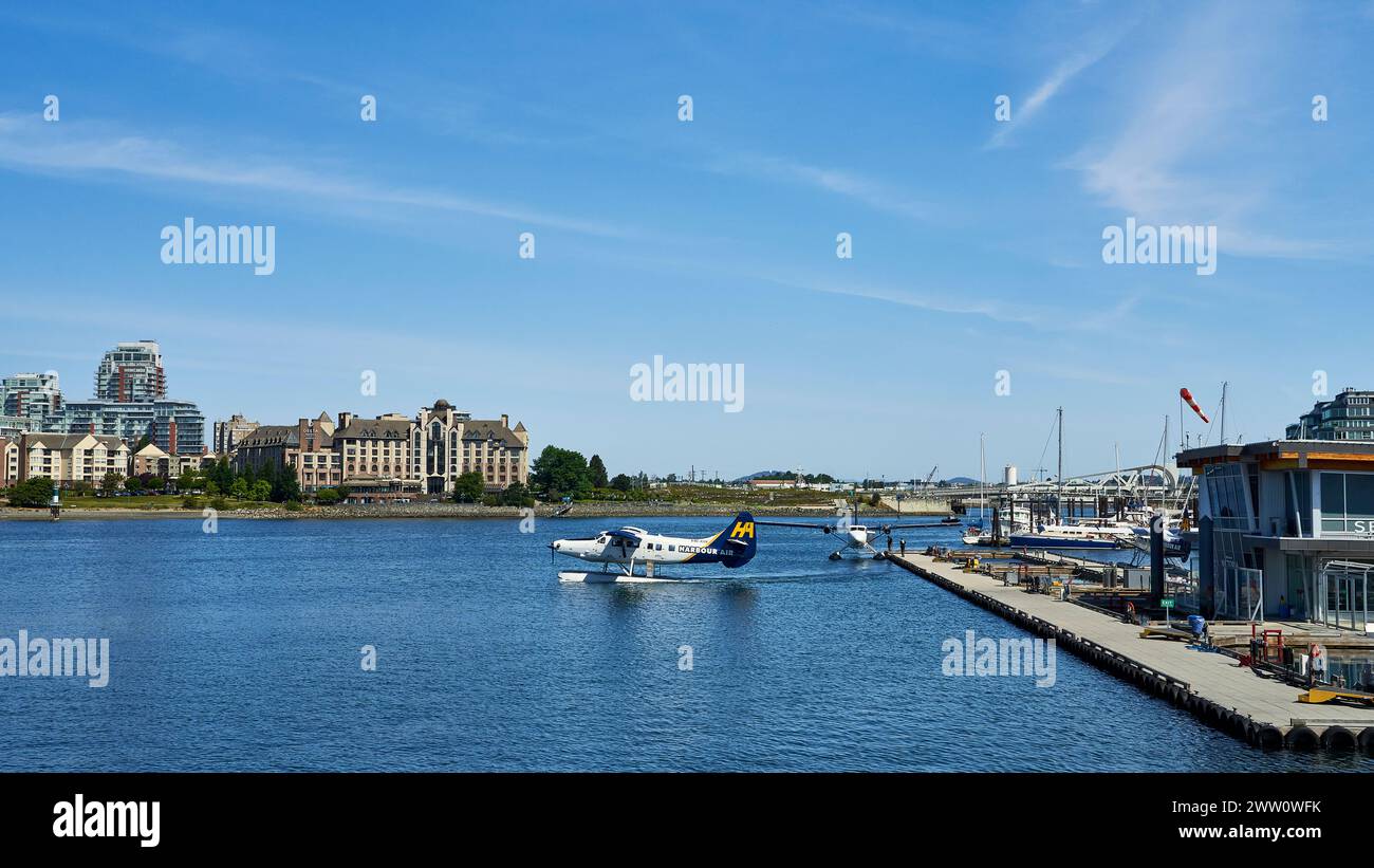 A Harbour Air float plane leaving the long dock at the sea plane base ...