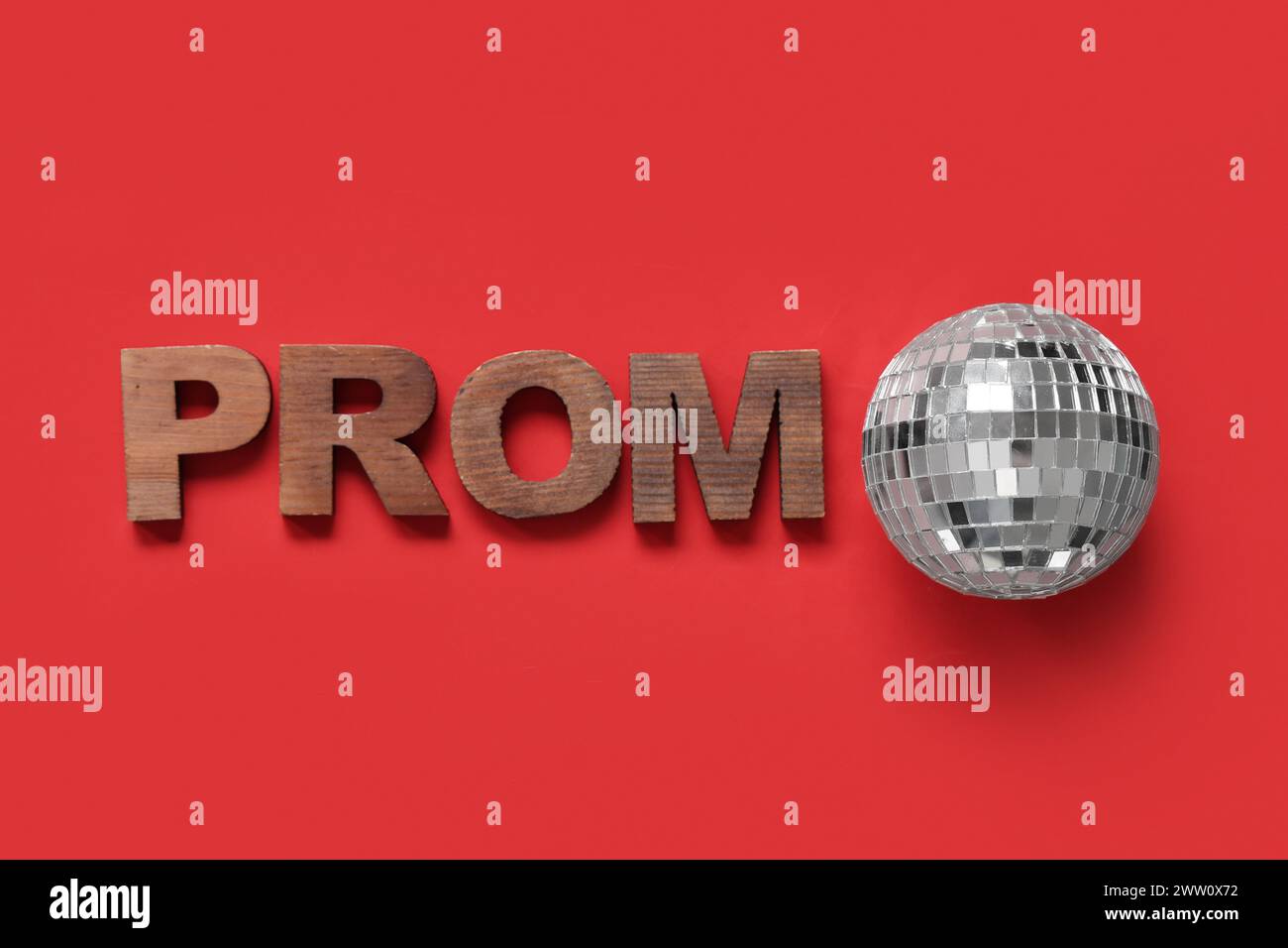 Word PROM with disco ball on red background Stock Photo - Alamy