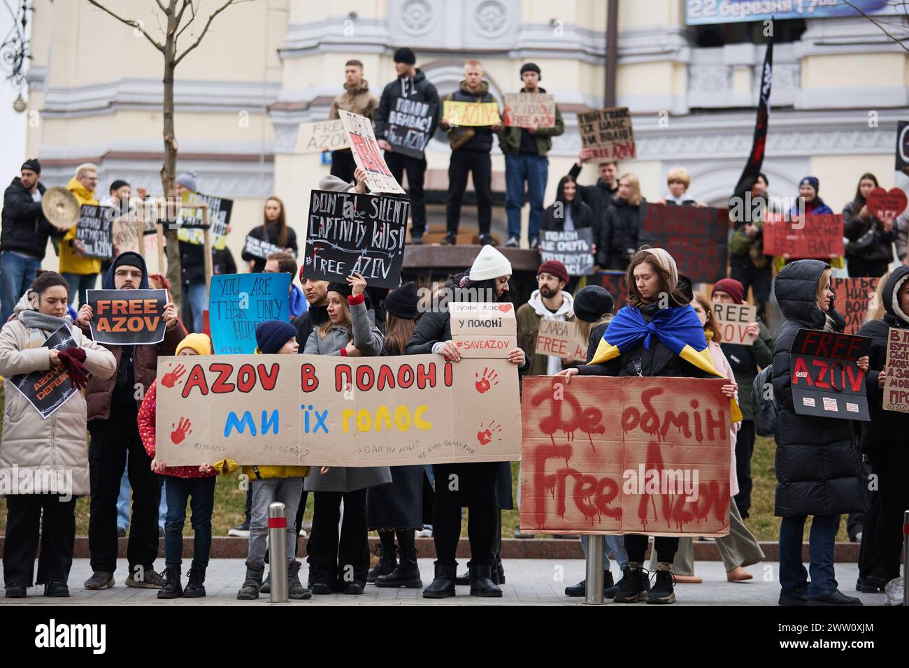 Large group of Ukrainian activists hold banners "Azov Is In Captivity ...