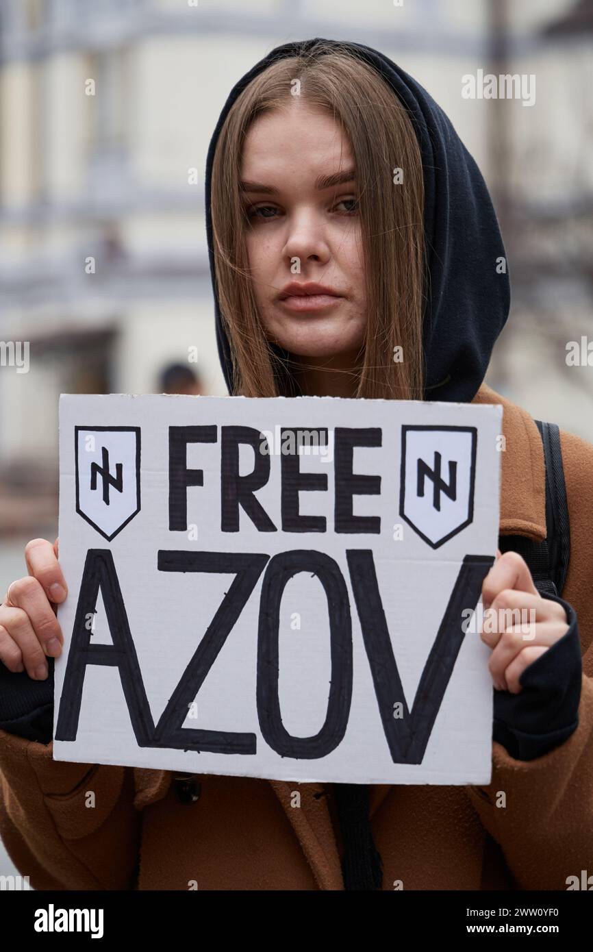 Young Ukrainian girl posing with a poster "Free Azov" on a peaceful ...