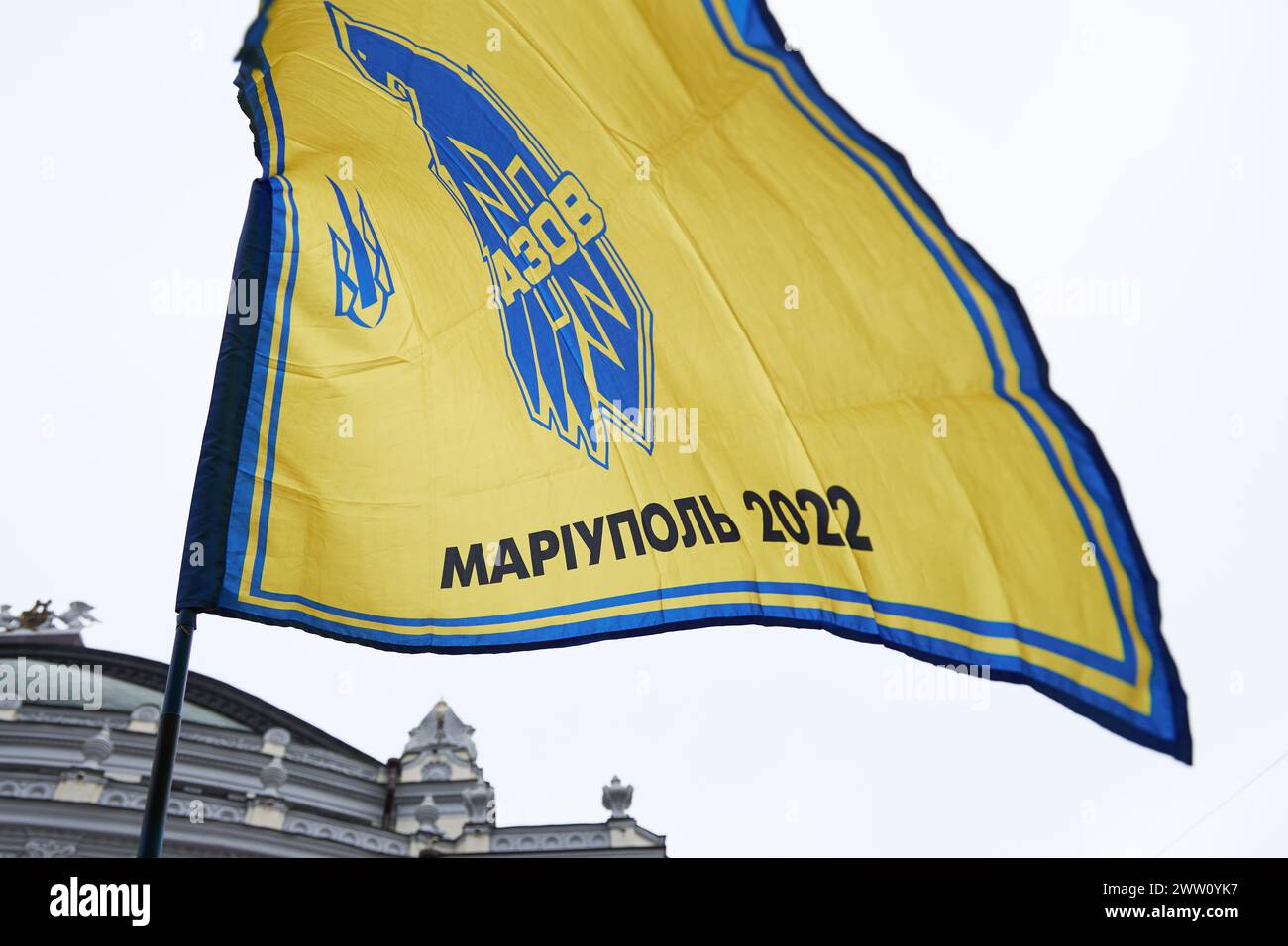 Flag of Azov brigade with a writing "Mariupol 2022" waving on a pole at ...