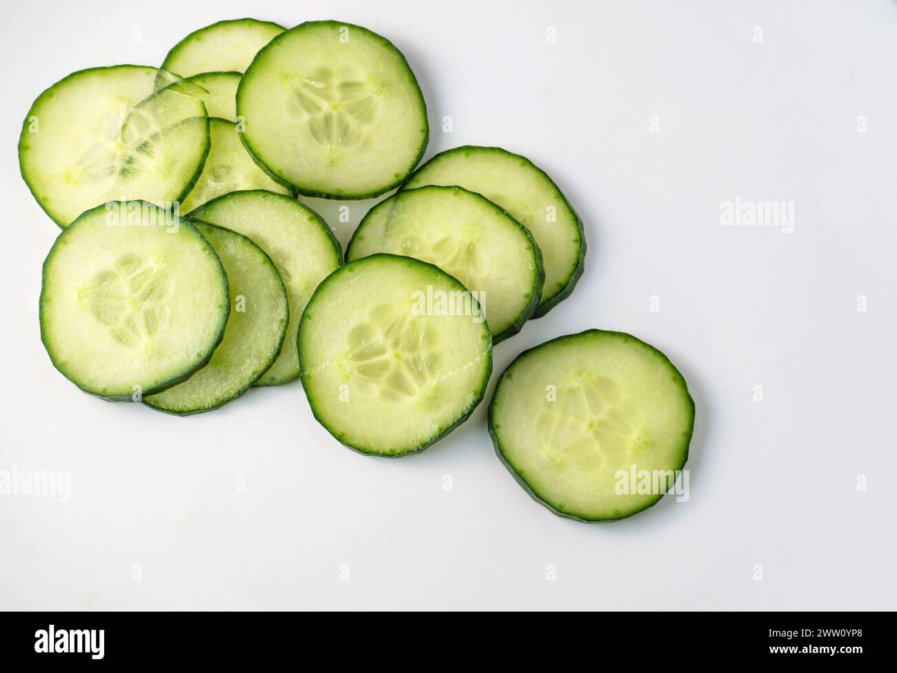 cucumber slices white background Stock Photo - Alamy