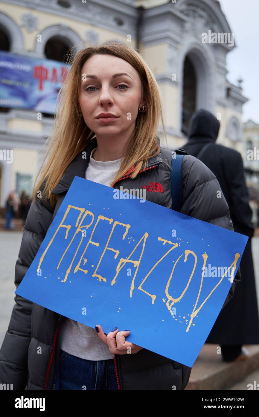 Ukrainian woman posing with a poster "Free Azov" on a rally dedicated ...