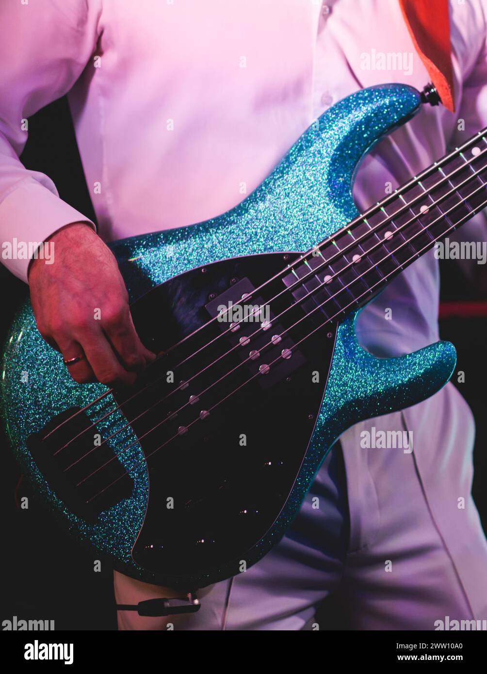 Concert view of a musician, electric bass guitar player with during ...