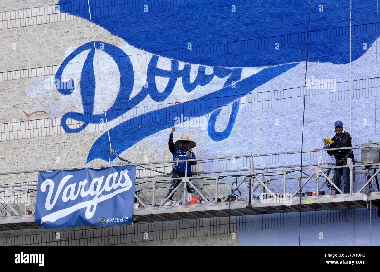 Muralist Robert Vargas, left, works on a new Los Angeles Dodgers ...