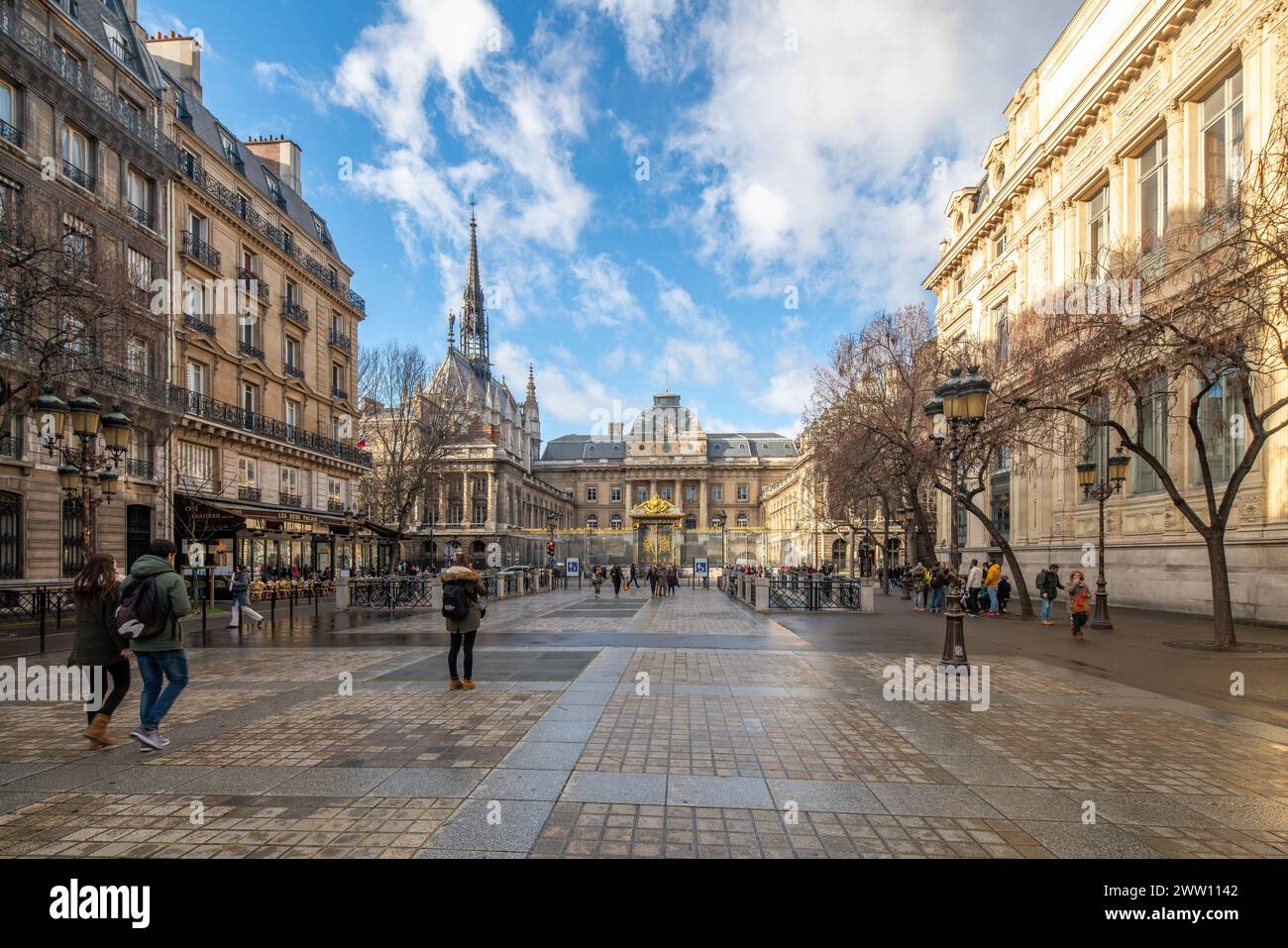Sunlight bathes Lutece Street with views of Sainte Chapelle and Palais ...