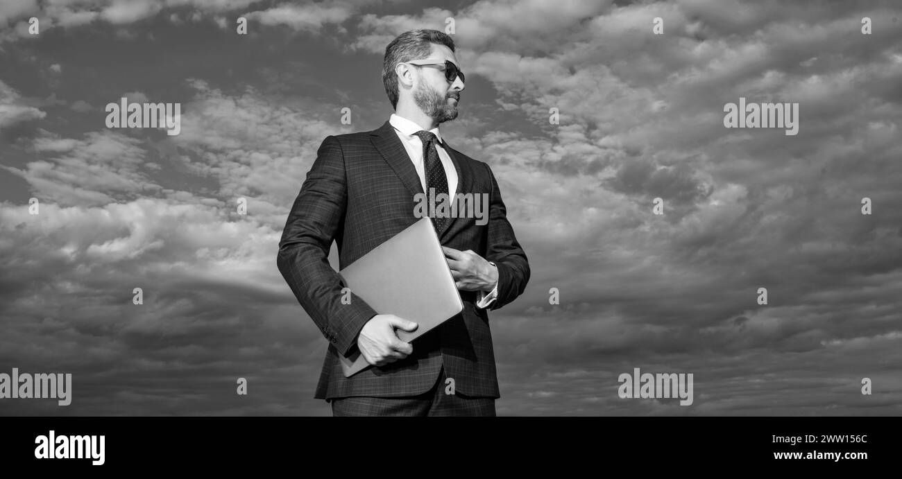 Successful IT director holding laptop. Professional man director ...