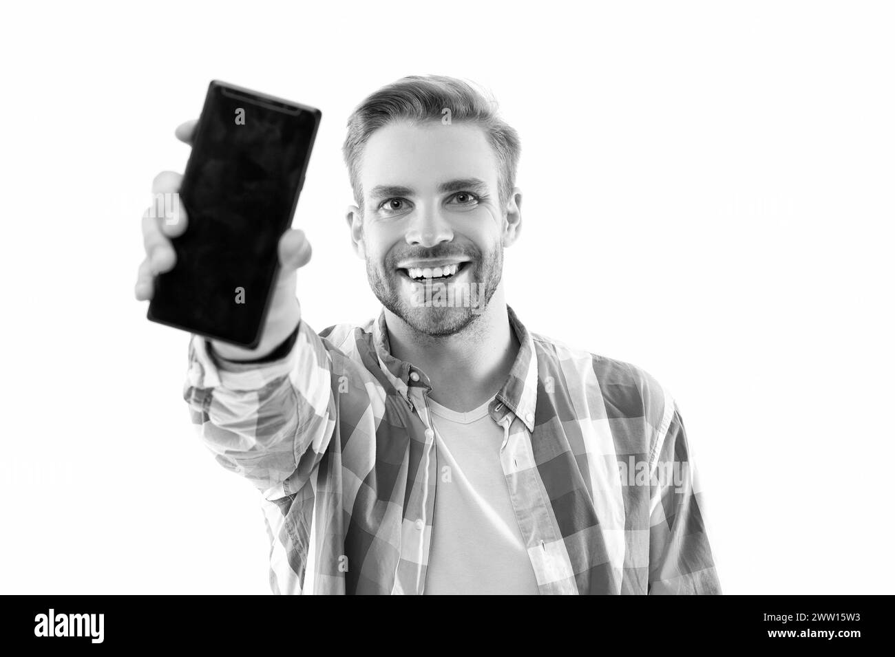 selective focus of man shows phone screen in studio. man showing phone ...