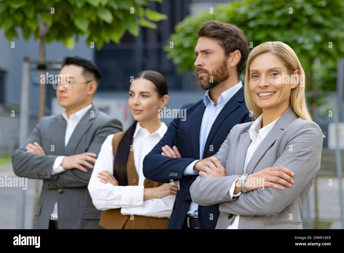 Group four smiling diverse professionals hi-res stock photography and ...