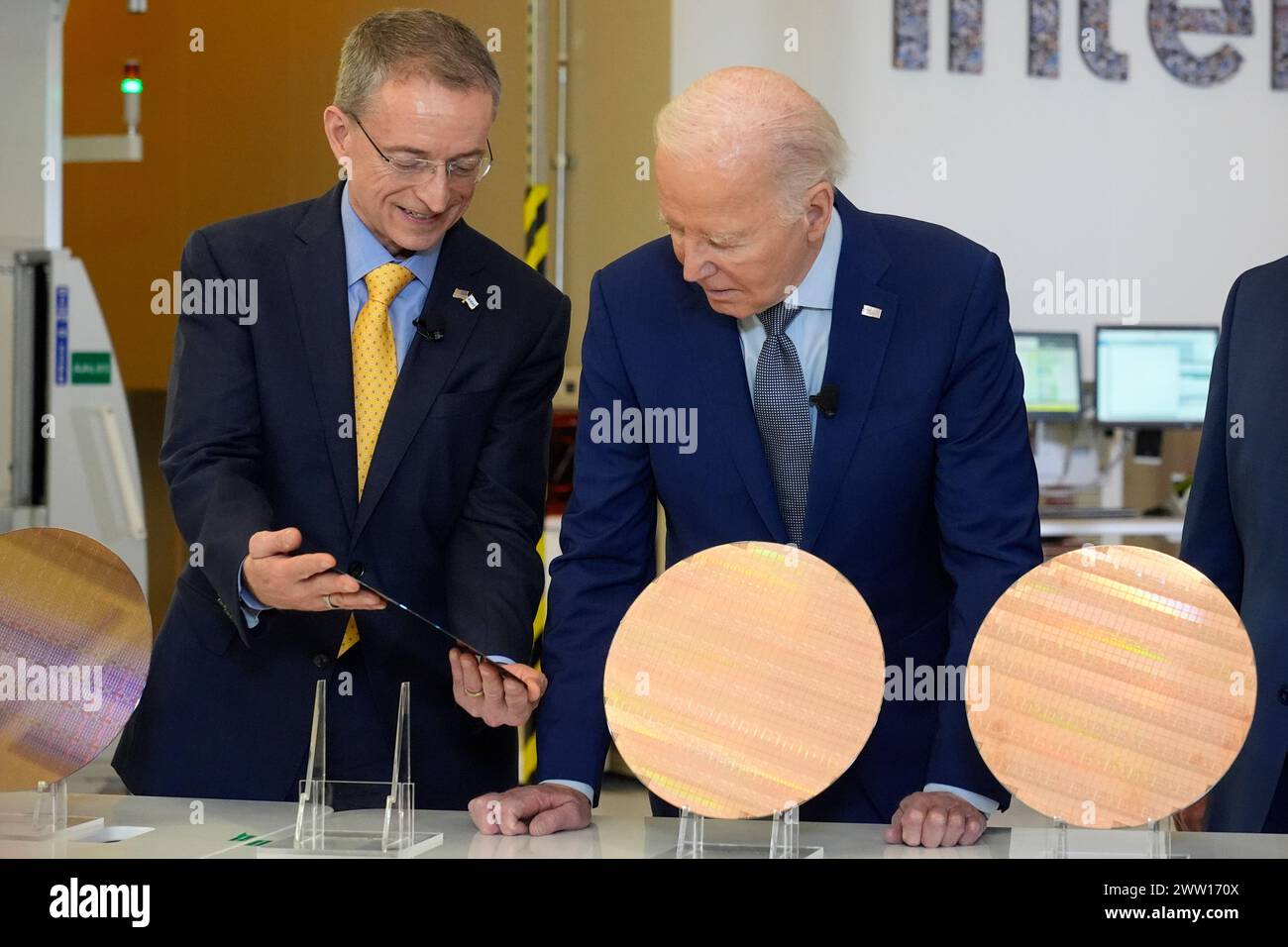 President Joe Biden listens to Intel CEO Pat Gelsinger, left, during a ...