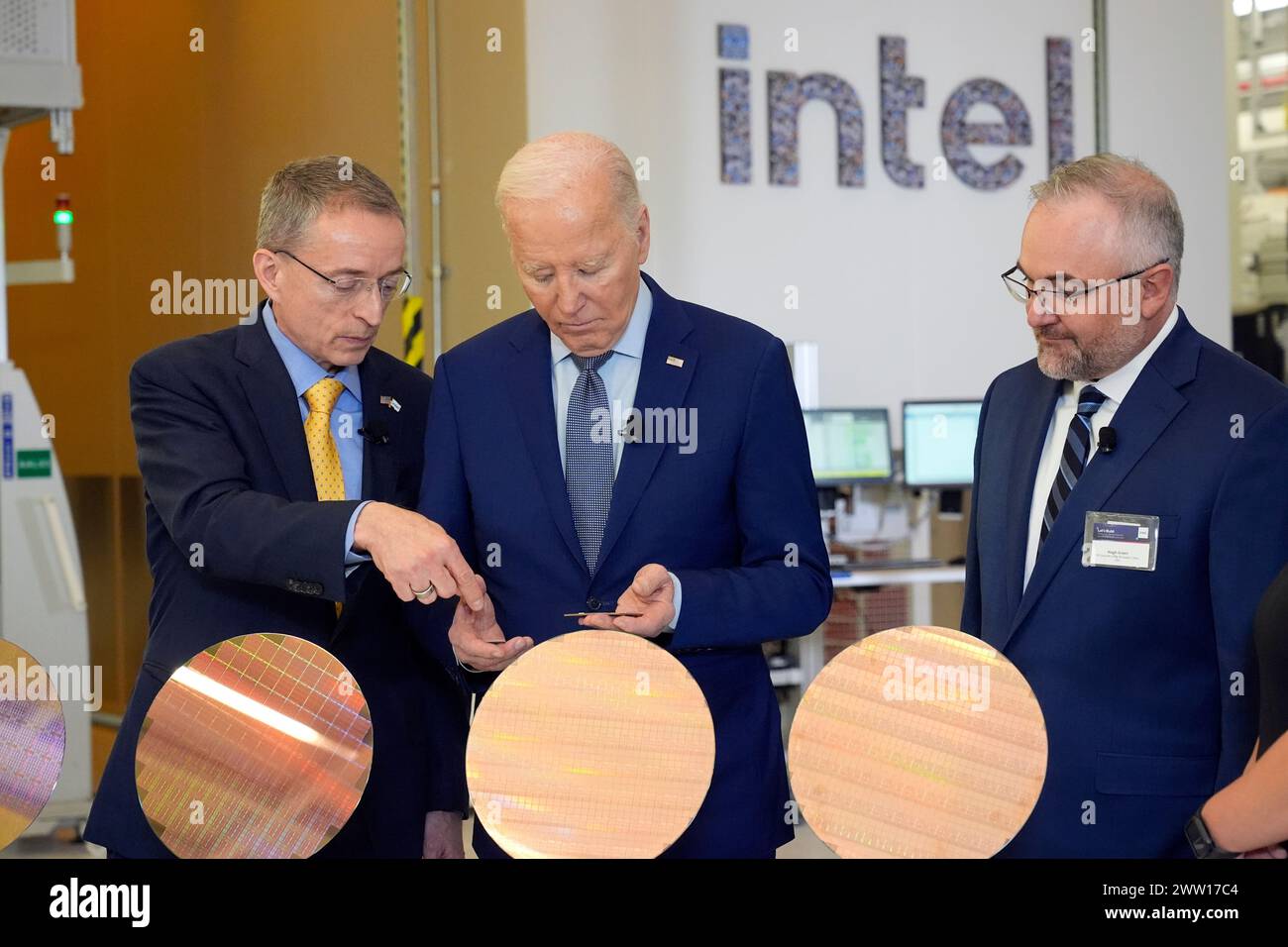 President Joe Biden listens to Intel CEO Pat Gelsinger, left, as Intel ...