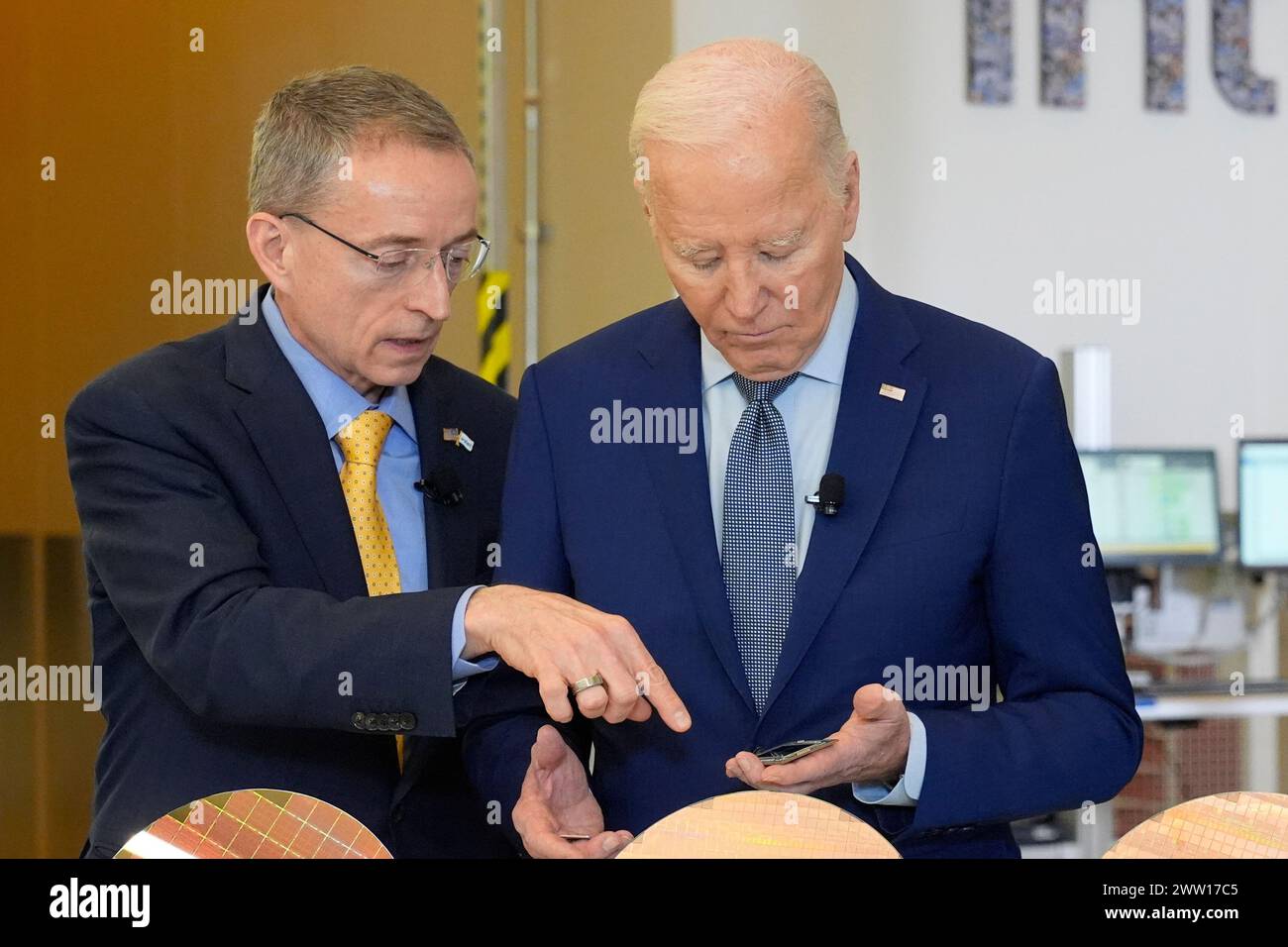 President Joe Biden listens to Intel CEO Pat Gelsinger, left, during a ...