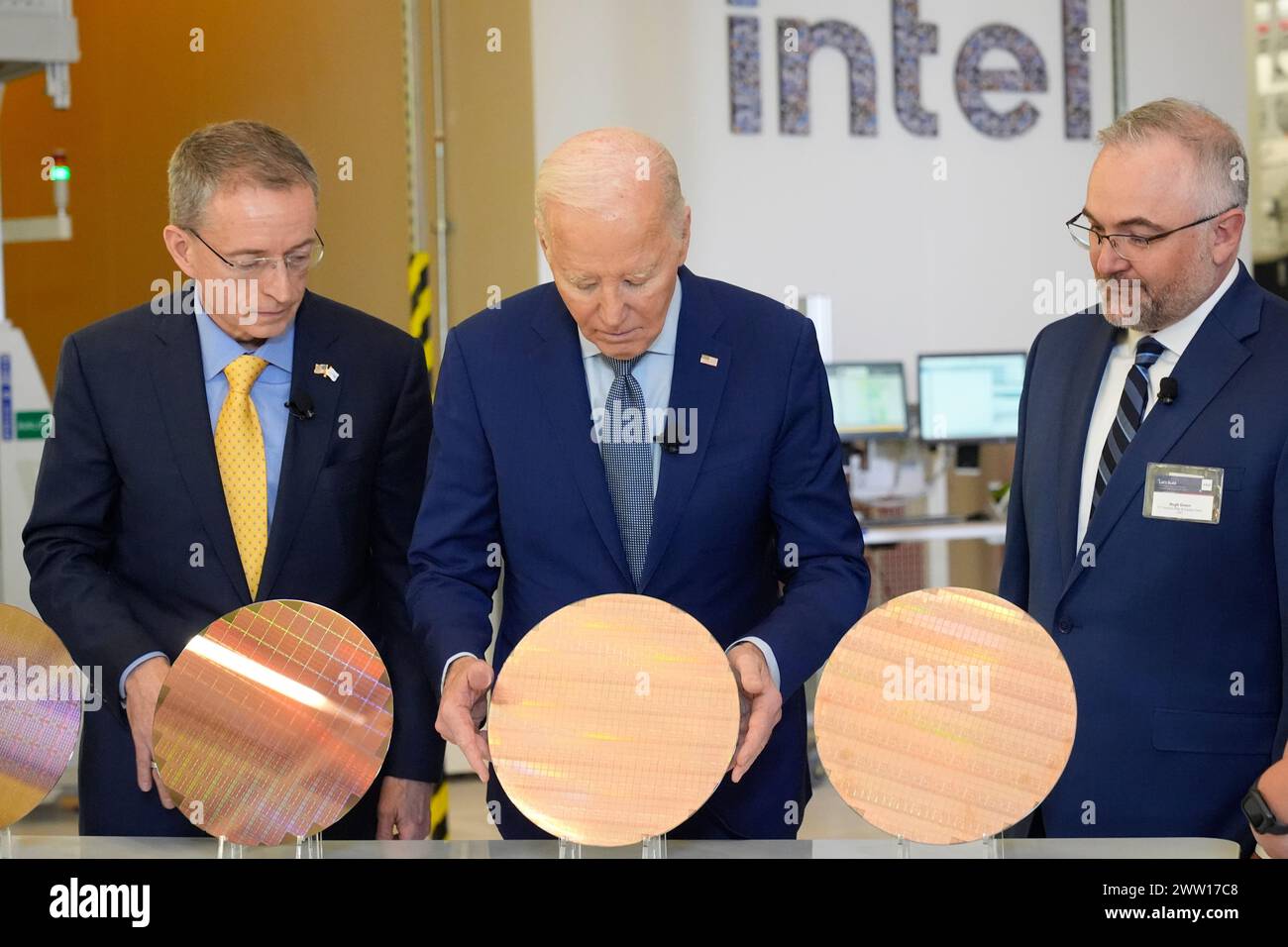 President Joe Biden listens to Intel CEO Pat Gelsinger, left, as Intel ...