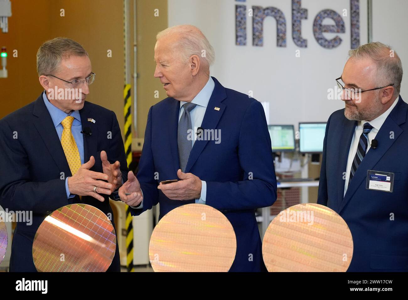 President Joe Biden listens to Intel CEO Pat Gelsinger, left, as Intel ...